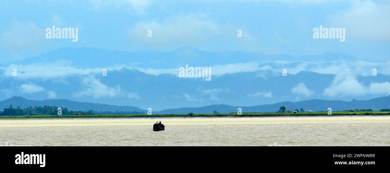 Misty mountains after a rainy morning seen from the Kaladan river in ...