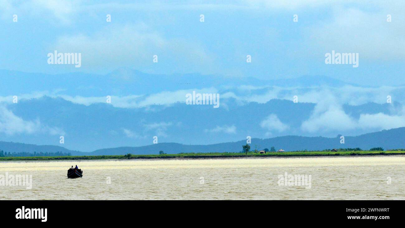 Misty mountains after a rainy morning seen from the Kaladan river in ...