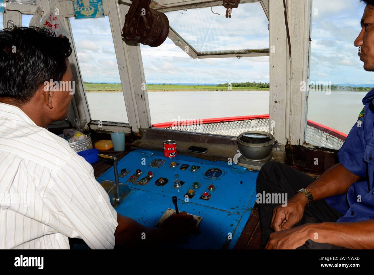 Captain of a boat on a trip between SIttwe and Mrauk-U in Rakhine State ...