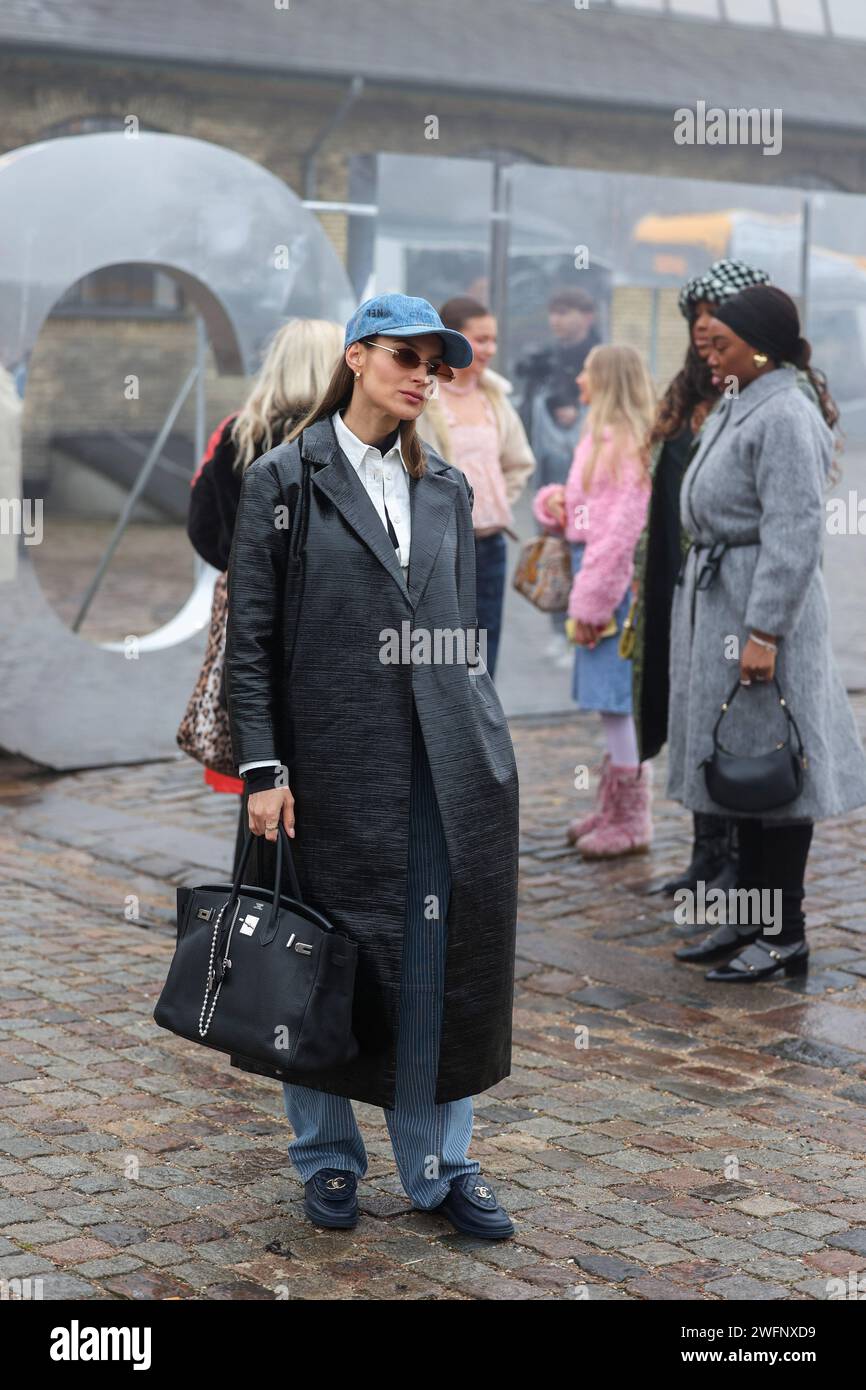 Copenhagen, Denmark. 30th Jan, 2024. A fashion influencer poses for ...