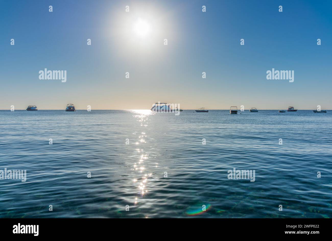 Sunrise over the sea. Panoramic seascape. Burning sky and shining ...