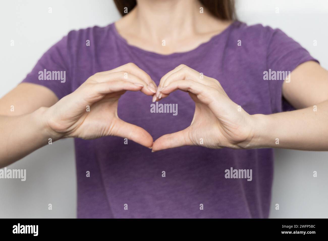 Inspire inclusion. Zoomers symbolize love. Faceless woman finger heart ...