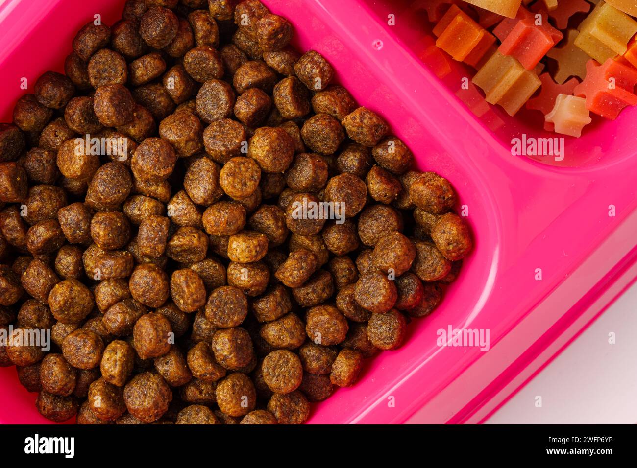 Dry pet food granules for background top view Stock Photo - Alamy