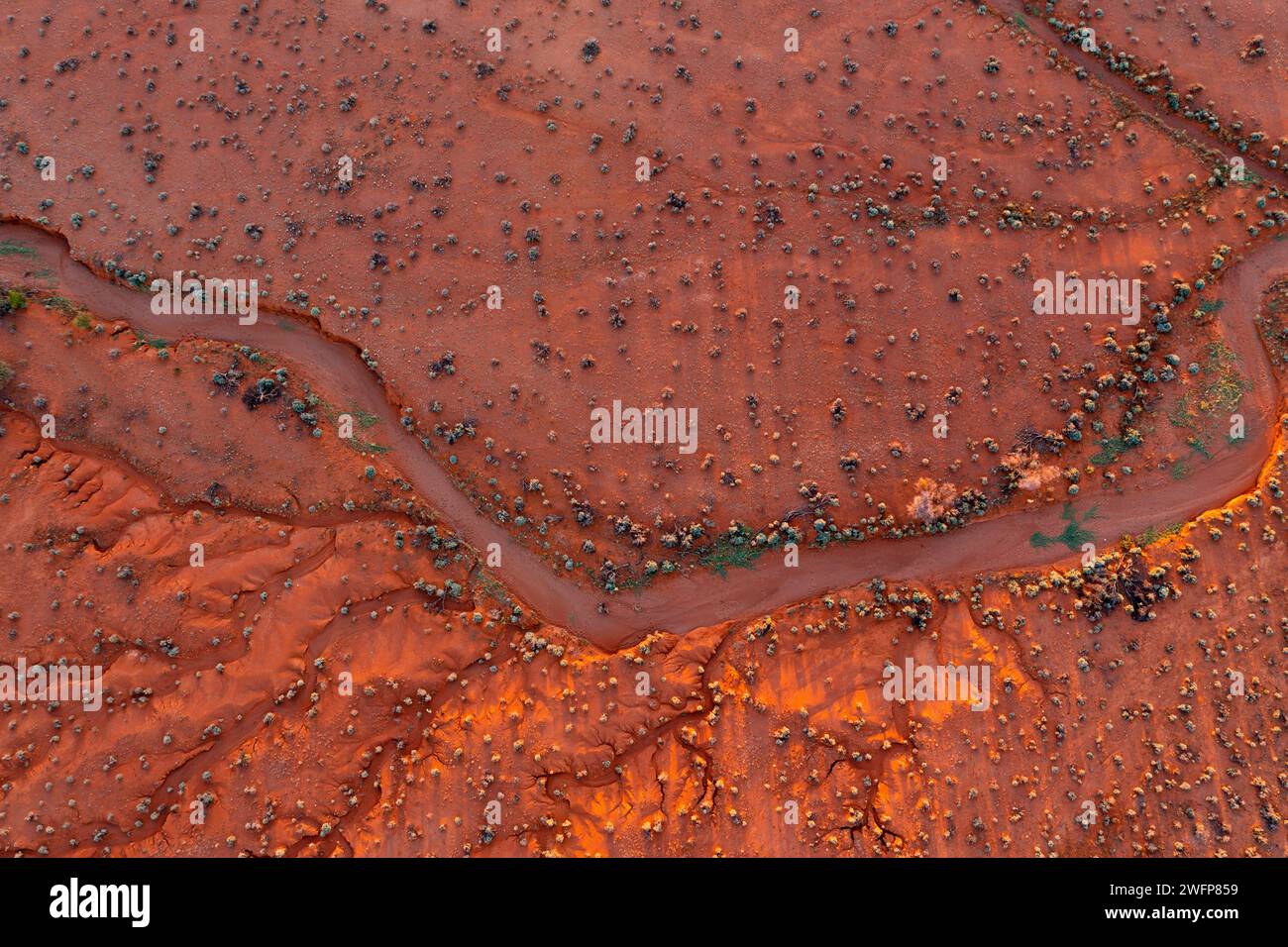 Aerial view of dry river beds meandering through an arid outback ...
