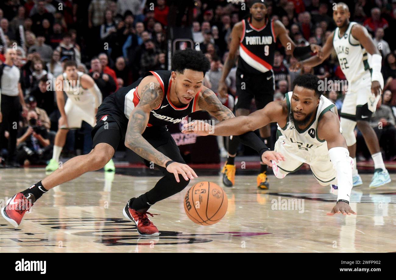 Portland Trail Blazers guard Anfernee Simons, left, and Milwaukee Bucks ...