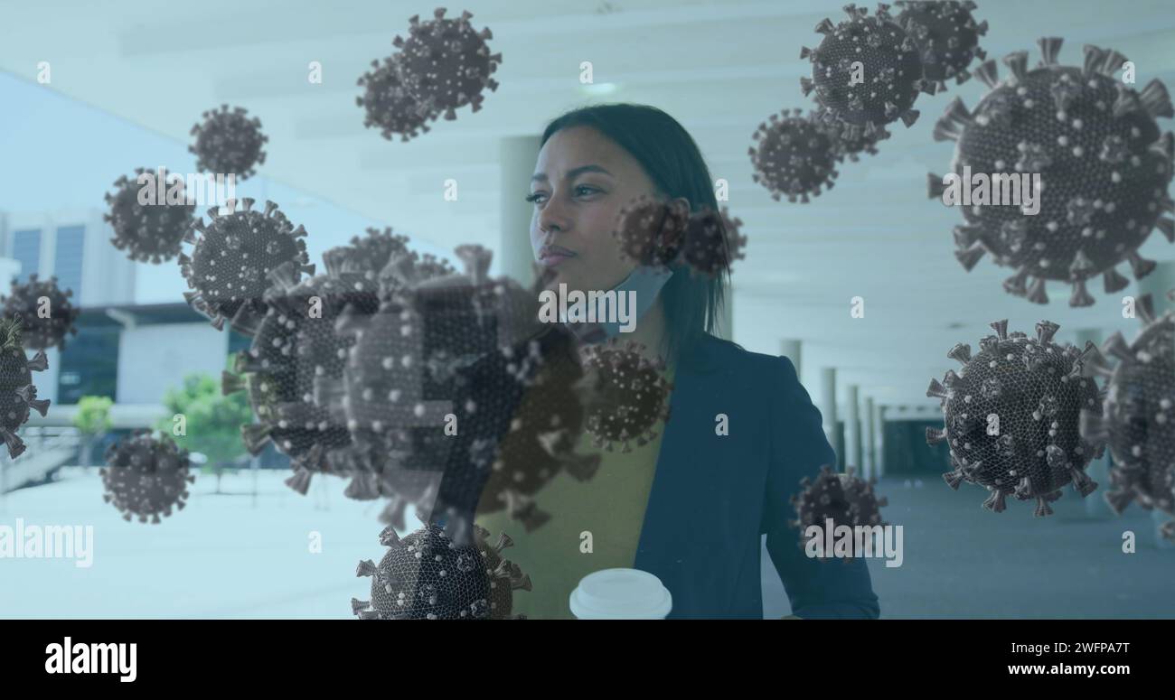 Image of covid 19 cells over woman with face mask Stock Photo - Alamy