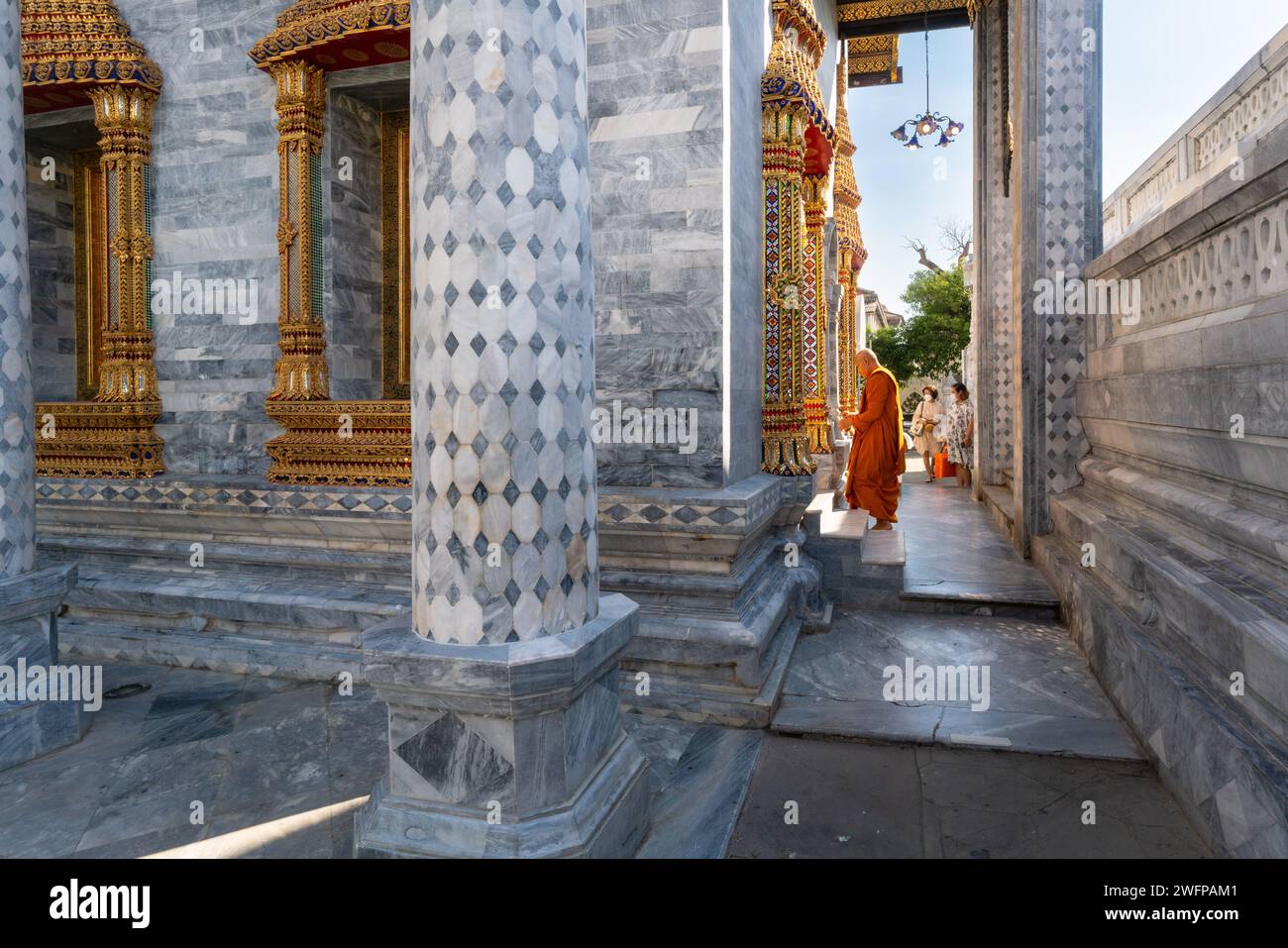 Bangkok, Thailand - Dec 5, 2023: A monk and worshippers were going ...