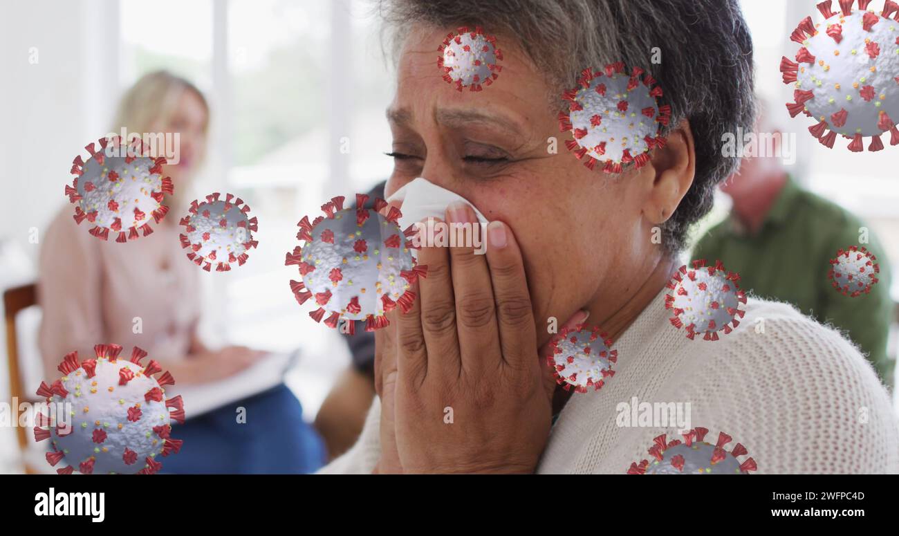 Multiple covid-19 cells floating against african american woman crying ...