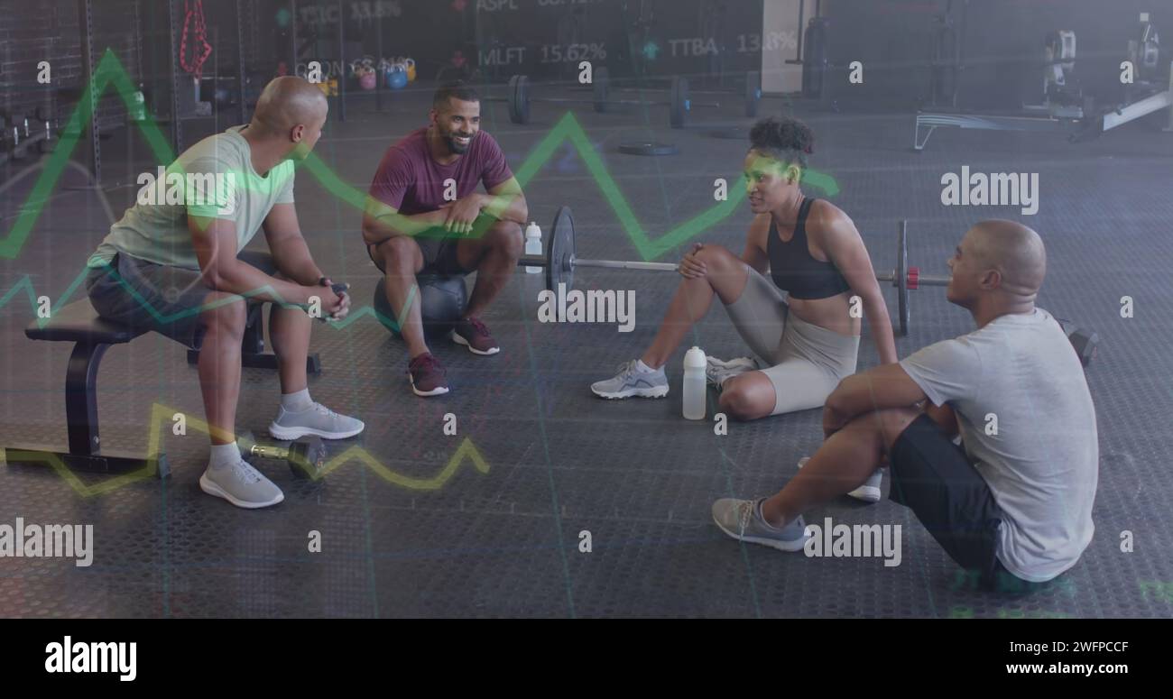 Image of data processing on graph over diverse fitness group sitting ...