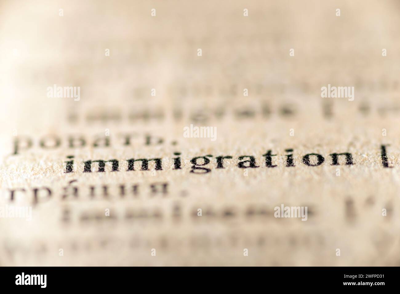 focus on immigration word printed inside vintage dictionary Stock Photo ...