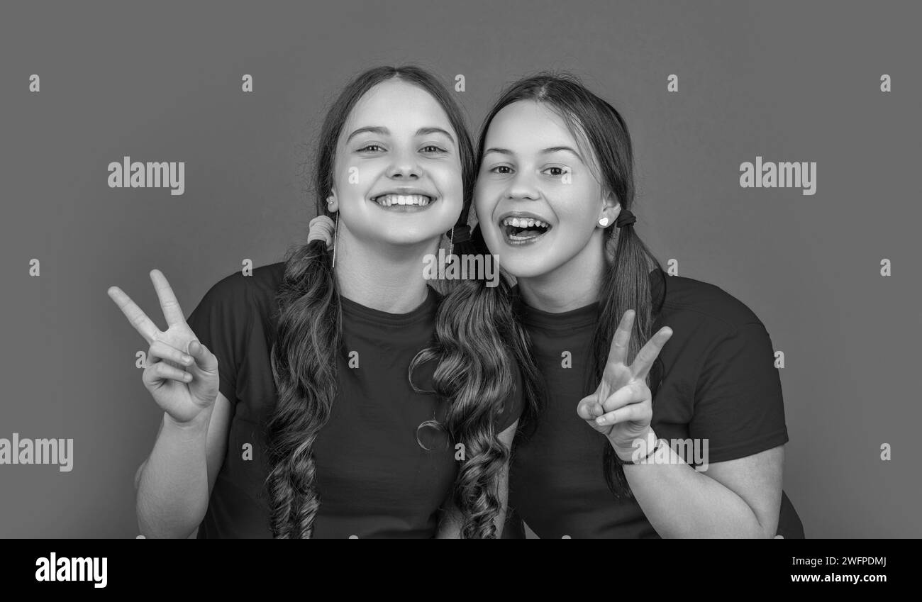 happy kids embracing on pink background. peace Stock Photo - Alamy