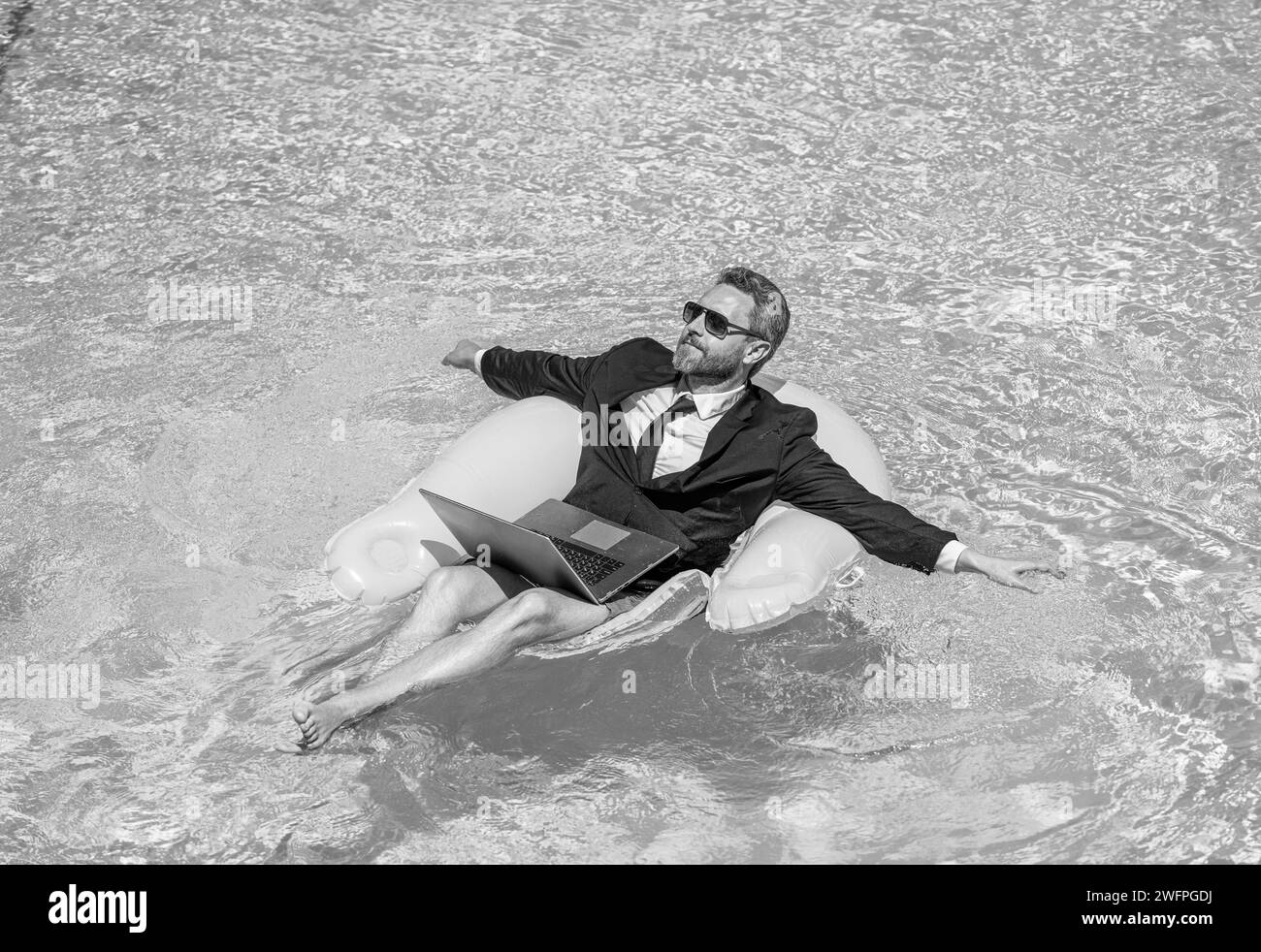 relaxed man trader work and relax. man trader work and relax in ...