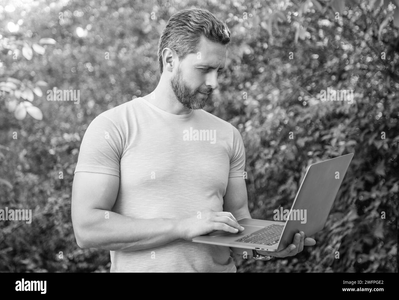image of freelancer man freelancing online with laptop outdoor Stock ...