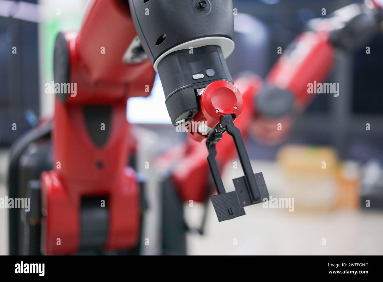 An artificial robotic hand working in a factory Stock Photo - Alamy