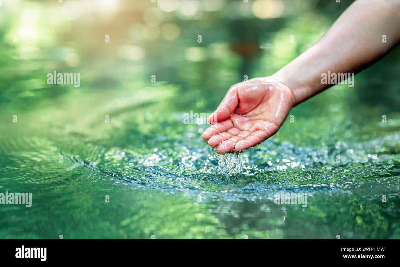 Hand in water catching water hi-res stock photography and images - Alamy