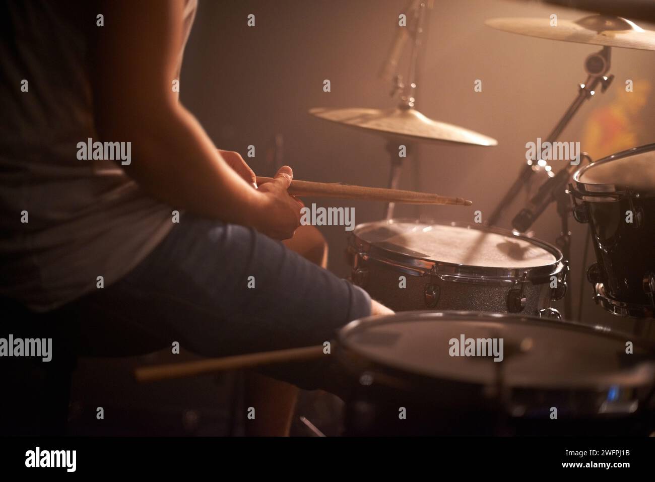 Hands, drummer and musician in performance at rock concert, music ...