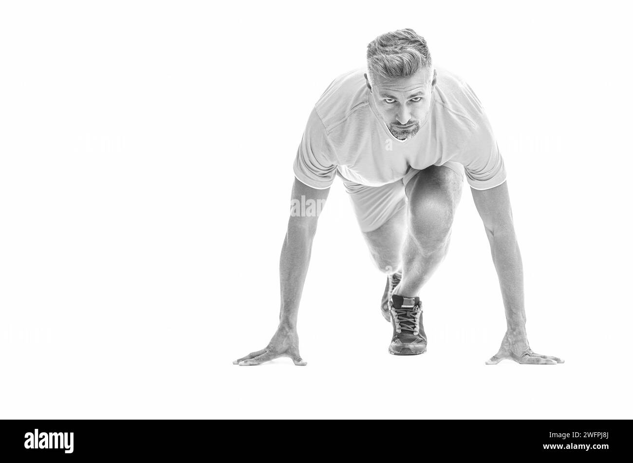 At the start line runner ready for action, copy space. runner getting ...