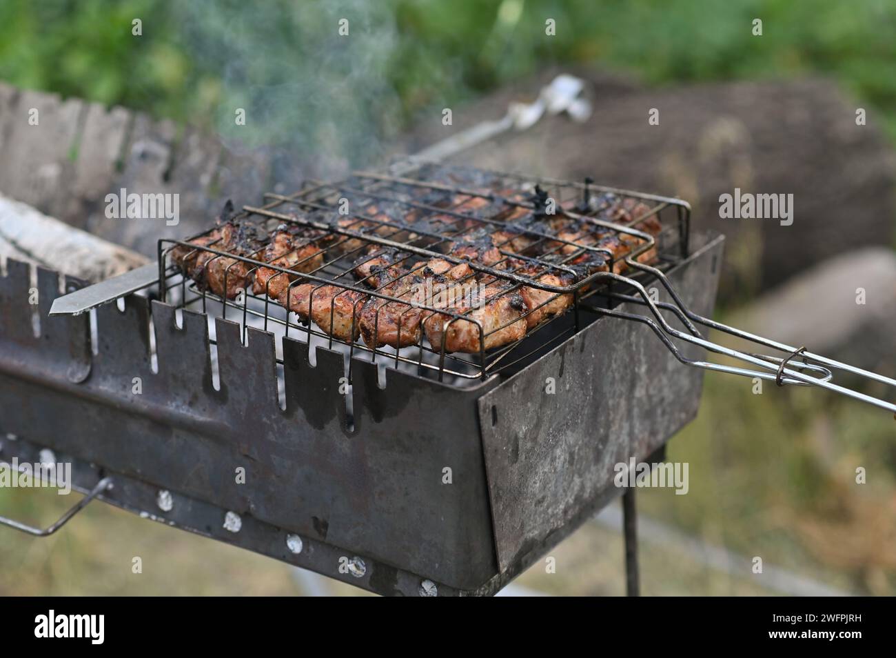 burning meat in the grill grate. bbq Stock Photo - Alamy