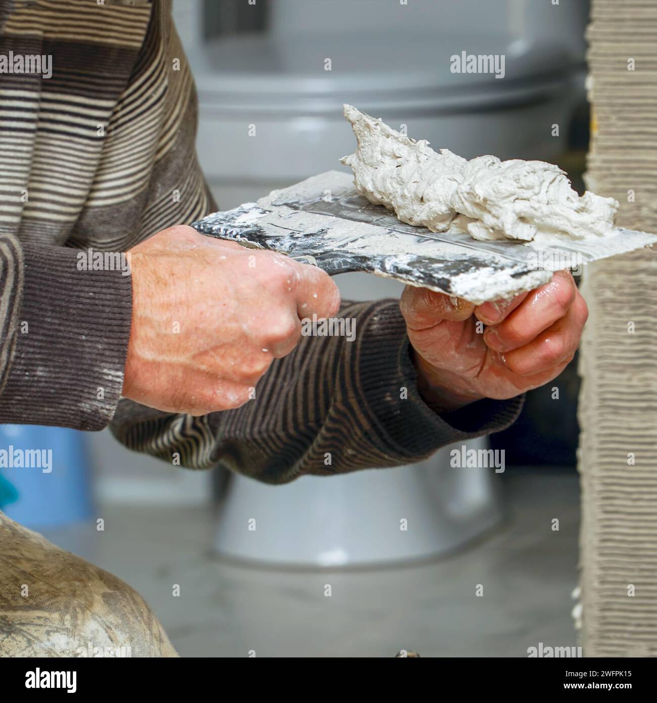 Hands mixing plaster hi-res stock photography and images - Alamy