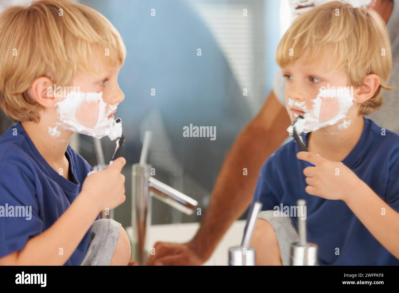 Shaving, dad and son with cream, razor on face and bonding in home with ...