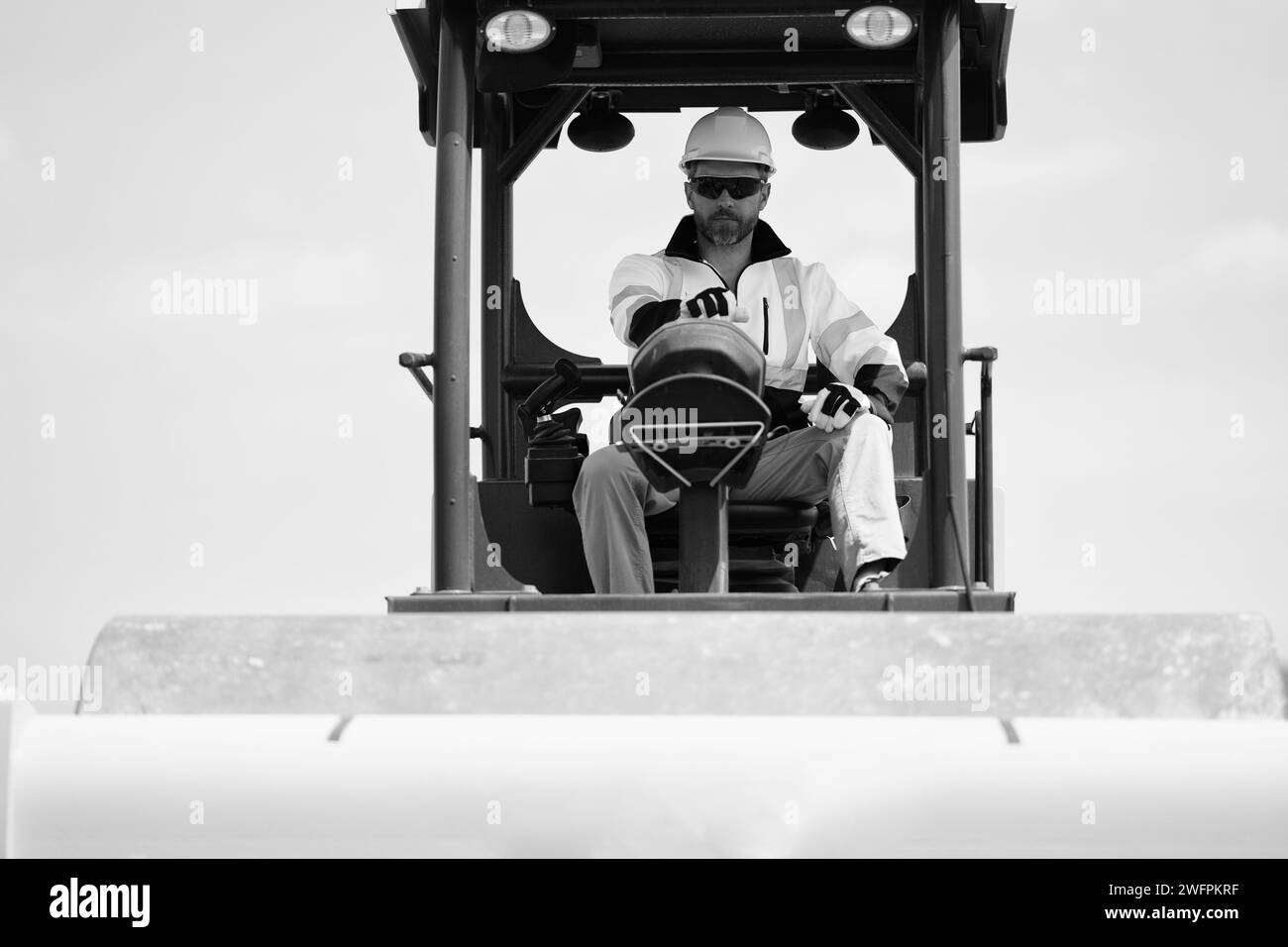Man compactor Black and White Stock Photos & Images - Alamy