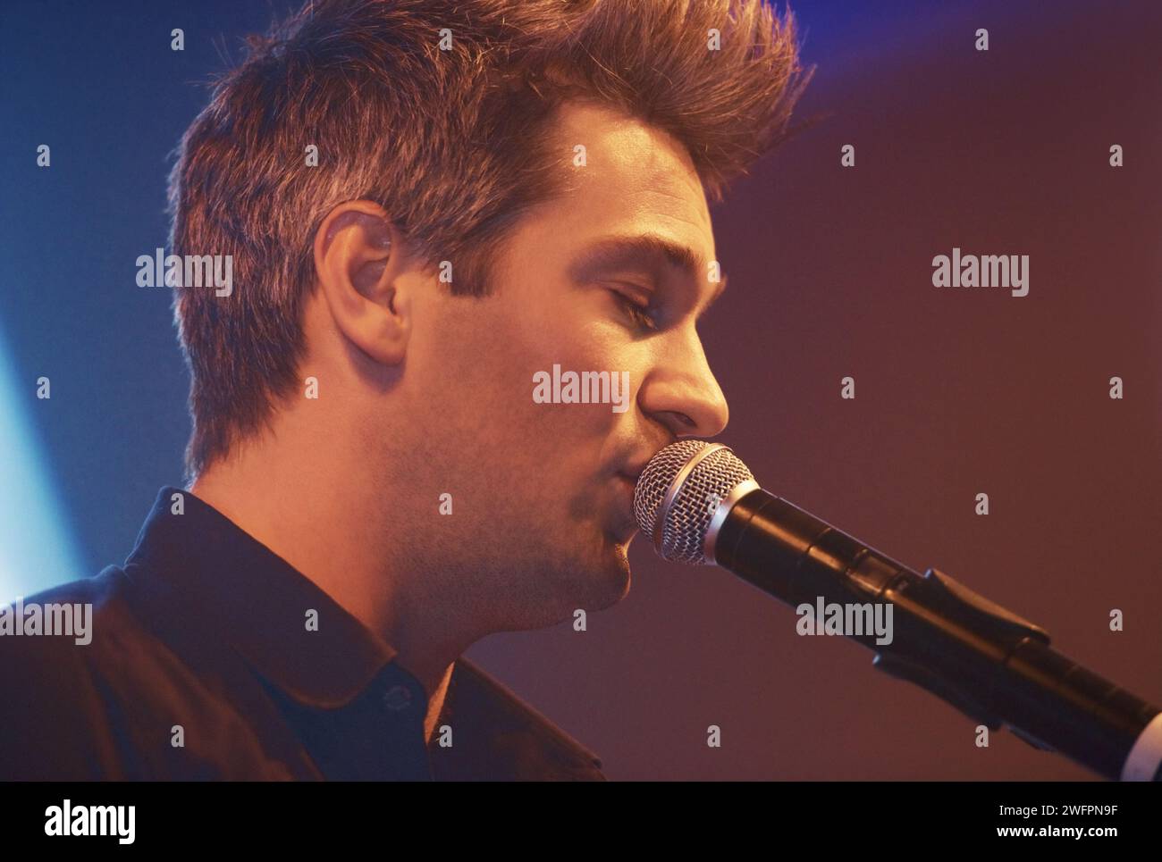 Singing, man and microphone for stage performance at concert with sound ...