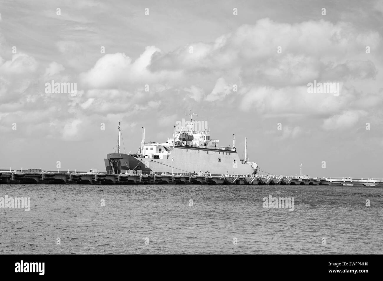 ferry ship in docked harbor, side view. ferry ship in harbor or seaport ...