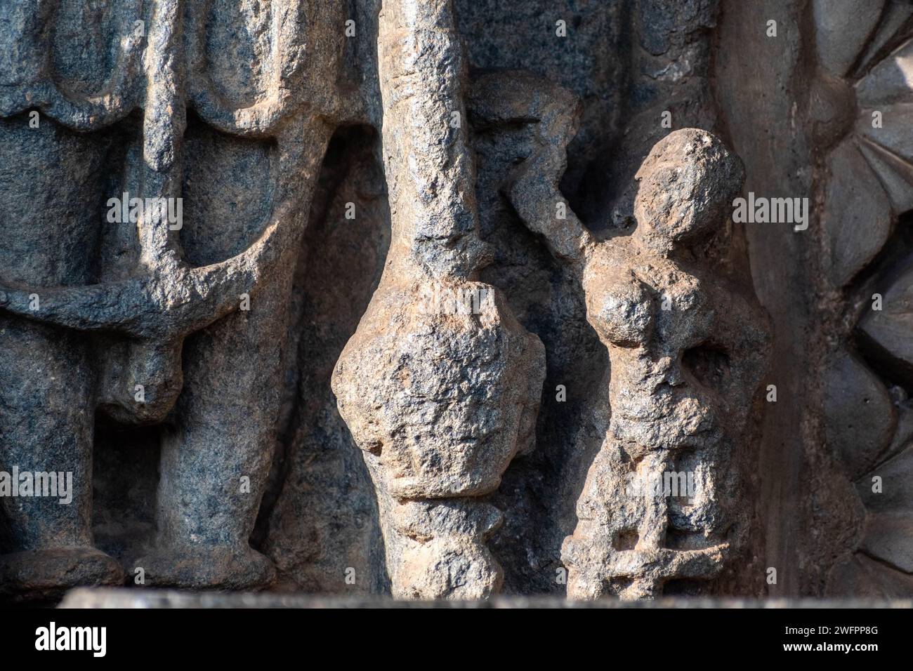Ruined carving of a dancing figurine on the wall of the ancient ...