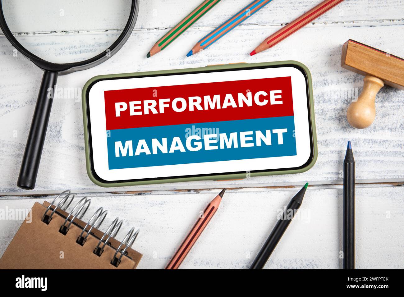 Performance Management. Mobile phone on white office table Stock Photo ...