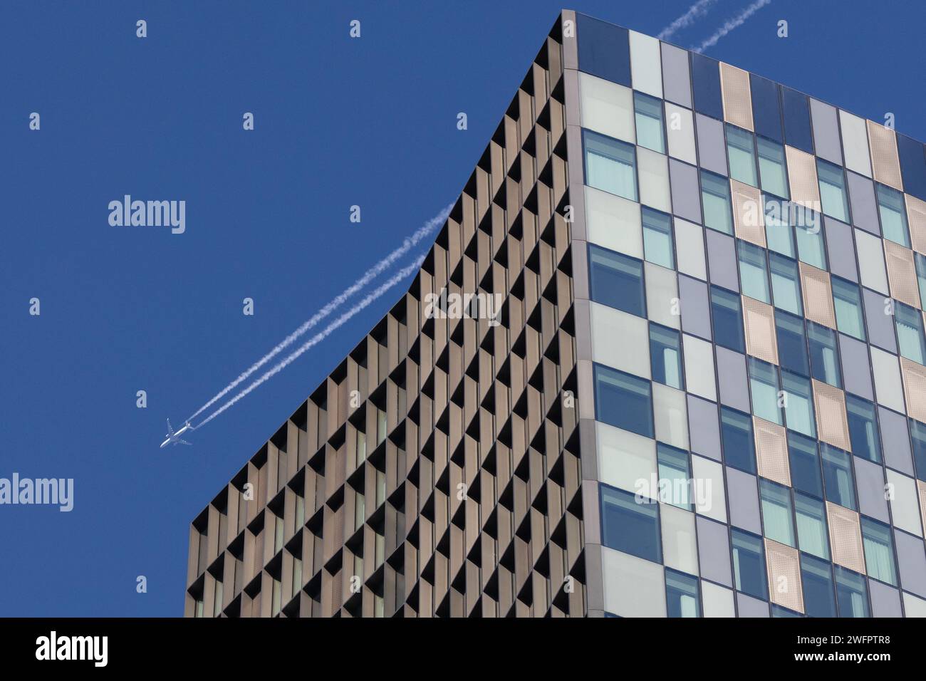 The Blade residential tower with a plane flying over Manchester. Part ...