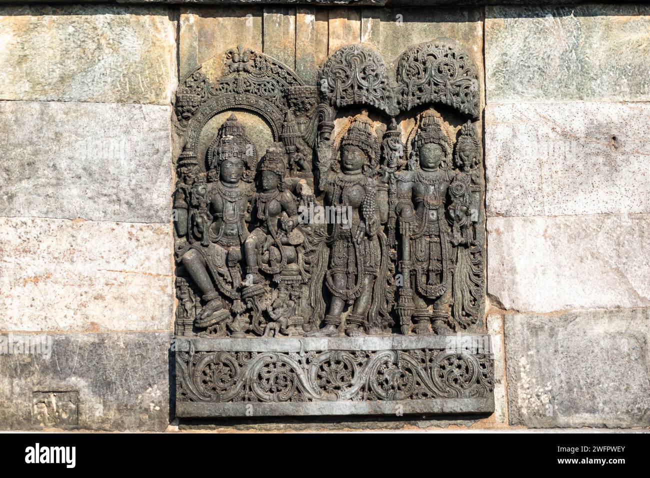 Ornate carvings of a Hindu deities at the ancient Hoysala era ...