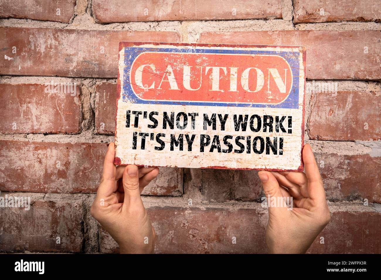 It's not my work. It's my passion. Caution sign in a woman's hand on a ...