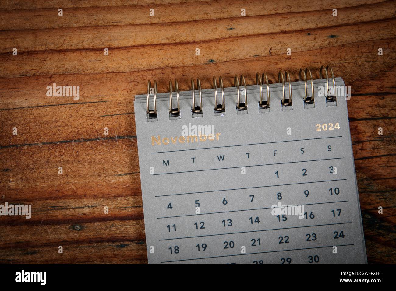 NOVEMBER. Green cardboard calendar on a wooden texture background Stock ...