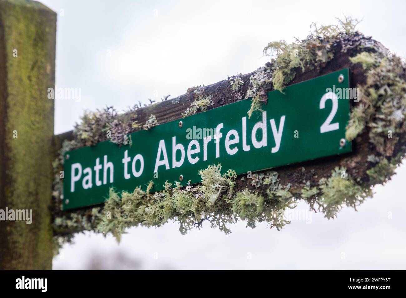 Walking sign post pointing to Aberfeldy Stock Photo - Alamy