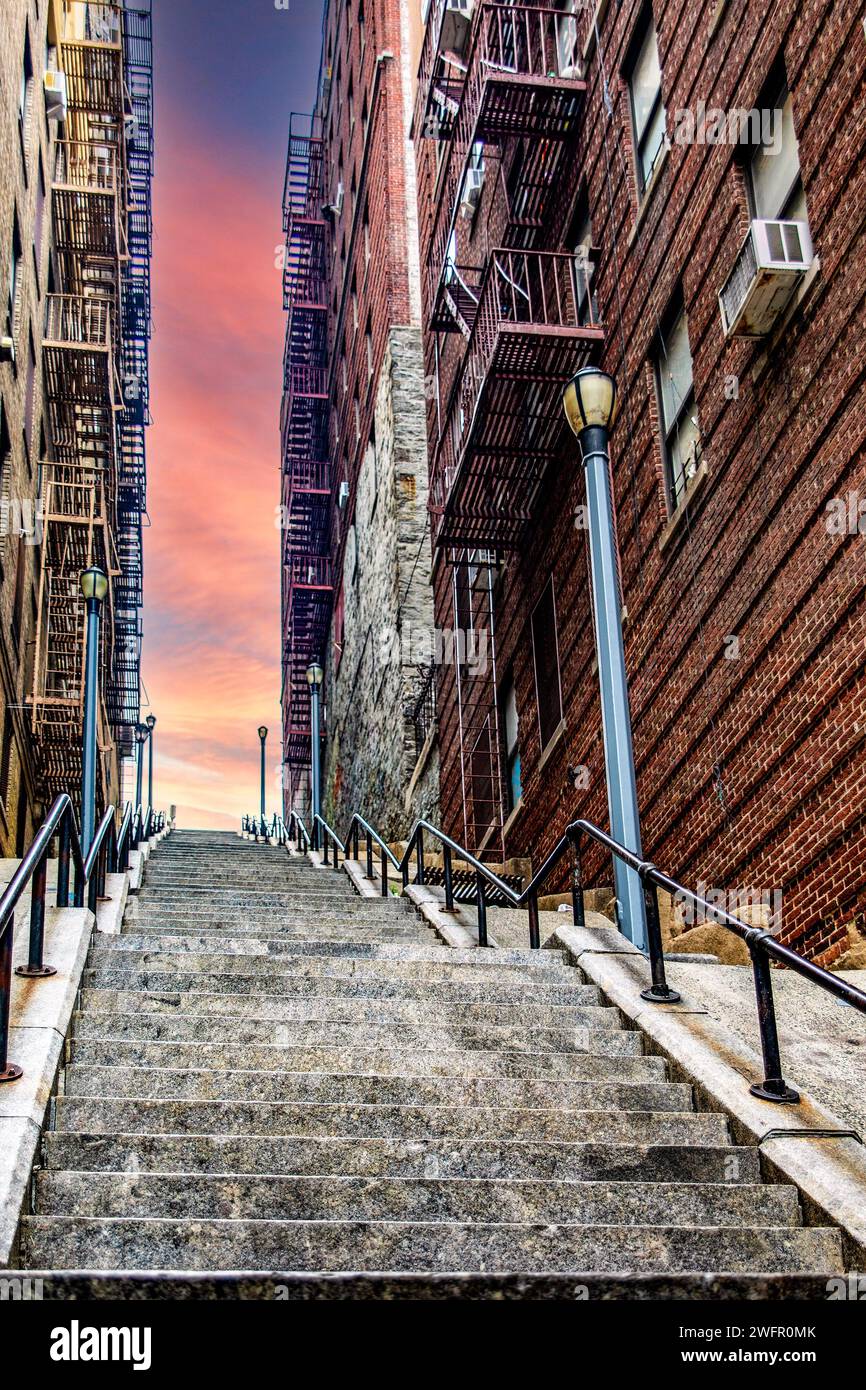 Vertical photo of the Joker stairs at an orange sunrise or sunset in ...