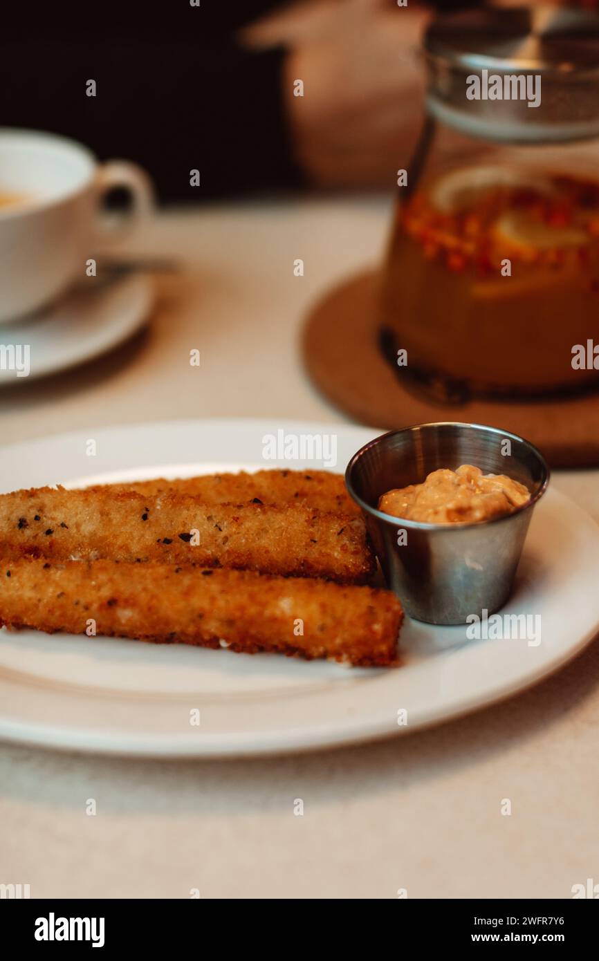 Deep fried cheese sticks with mayonnaise cream. Quick and tasty snack ...