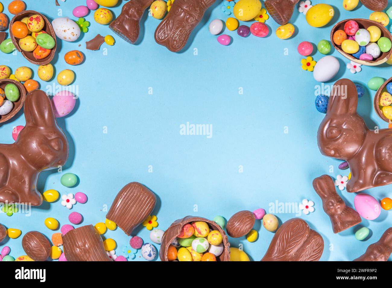 Easter chocolate egg and bunny background. High-colored flat lay with ...