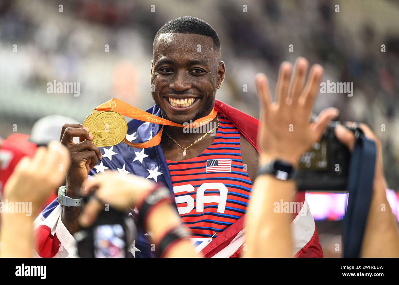 Grant HOLLOWAY celebrating his medal with the flag in the Budapest 2023 ...