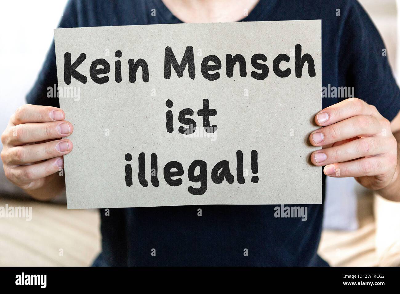 1 February 2024: A man holds a poster with the inscription: Kein Mensch ...