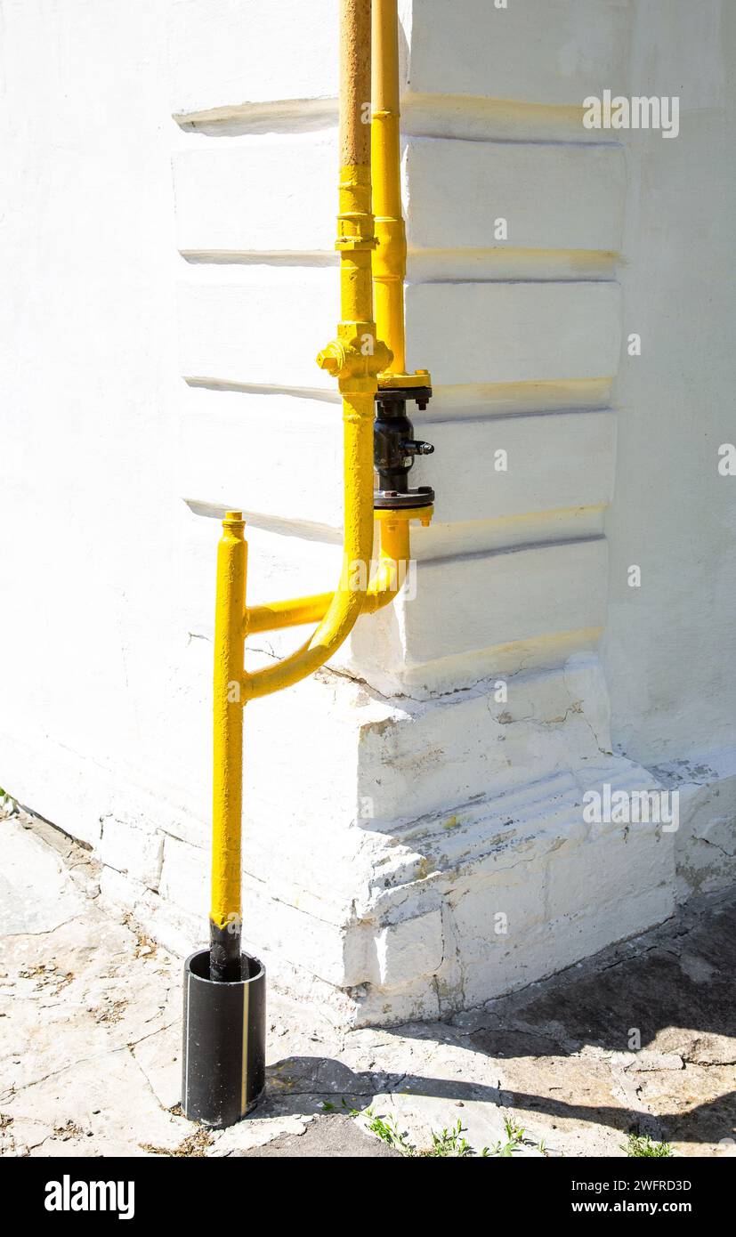 Gas entry point to a residential building. Gas pipes with valve on the ...