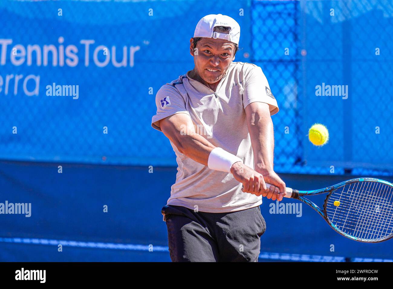 Tatsuma Ito of Japan in action during the Quarter Finals of the 2023 ITF M25 Canberra Claycourt ...
