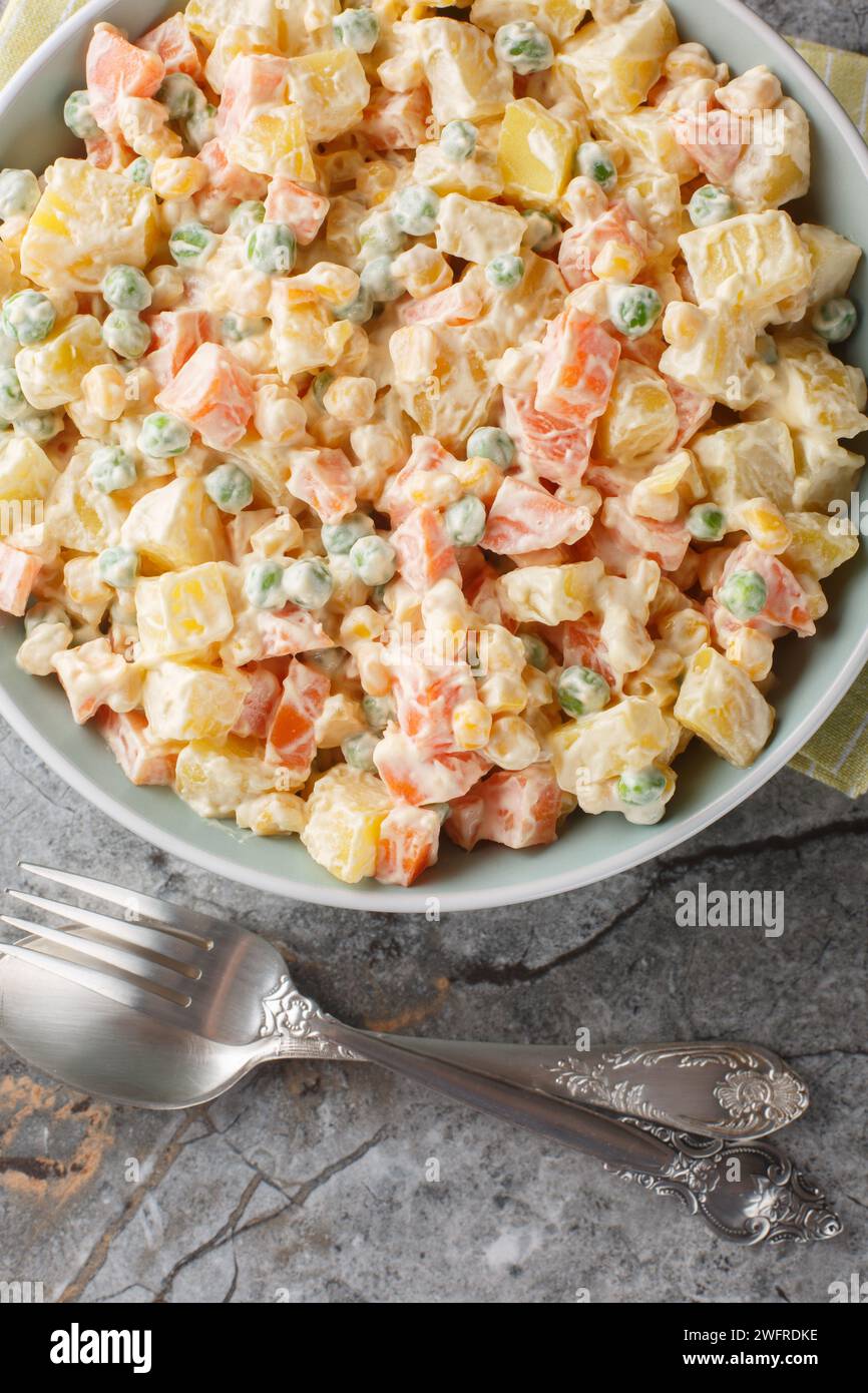 Delicious Brazilian gaucho salad with potatoes, green peas, carrots ...