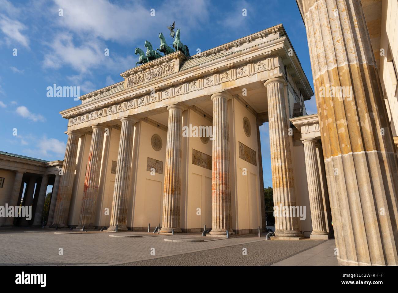 A captivating image of Brandenburg Gate in Berlin, bathed in warm ...