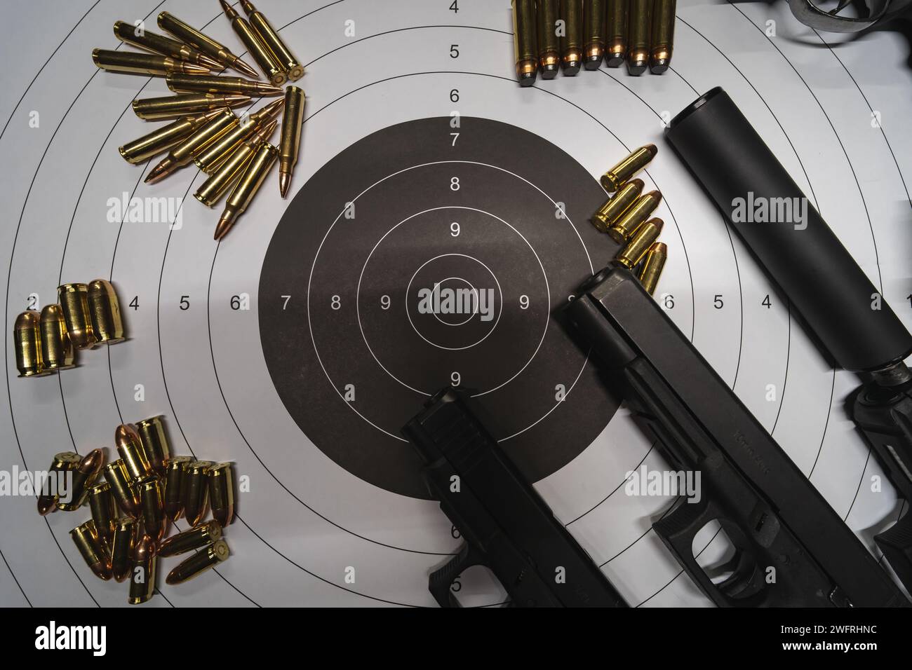 Firearms, paper target for shooting, pistols, silencer and cartridges ...
