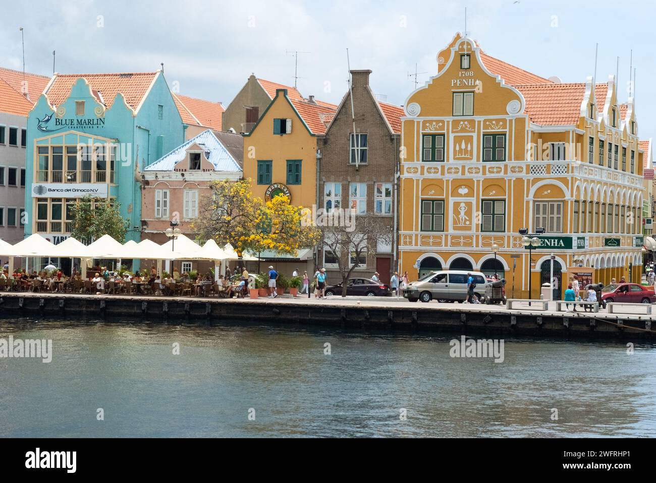 Historic colorful buildings along the waterfront promenade with outdoor ...