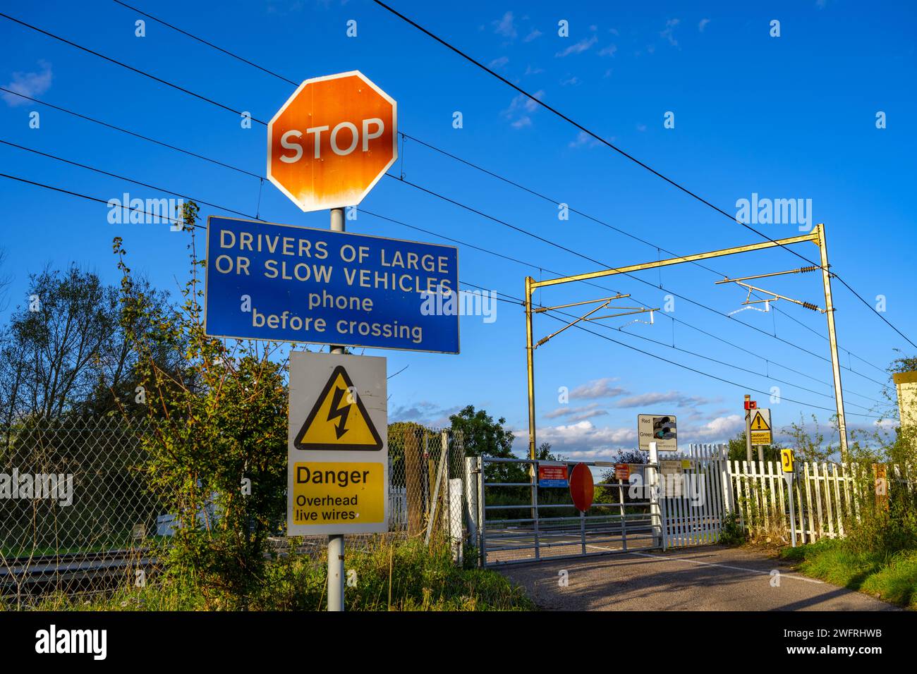 Stop light at Level crossing of the main line to East Anglia near ...