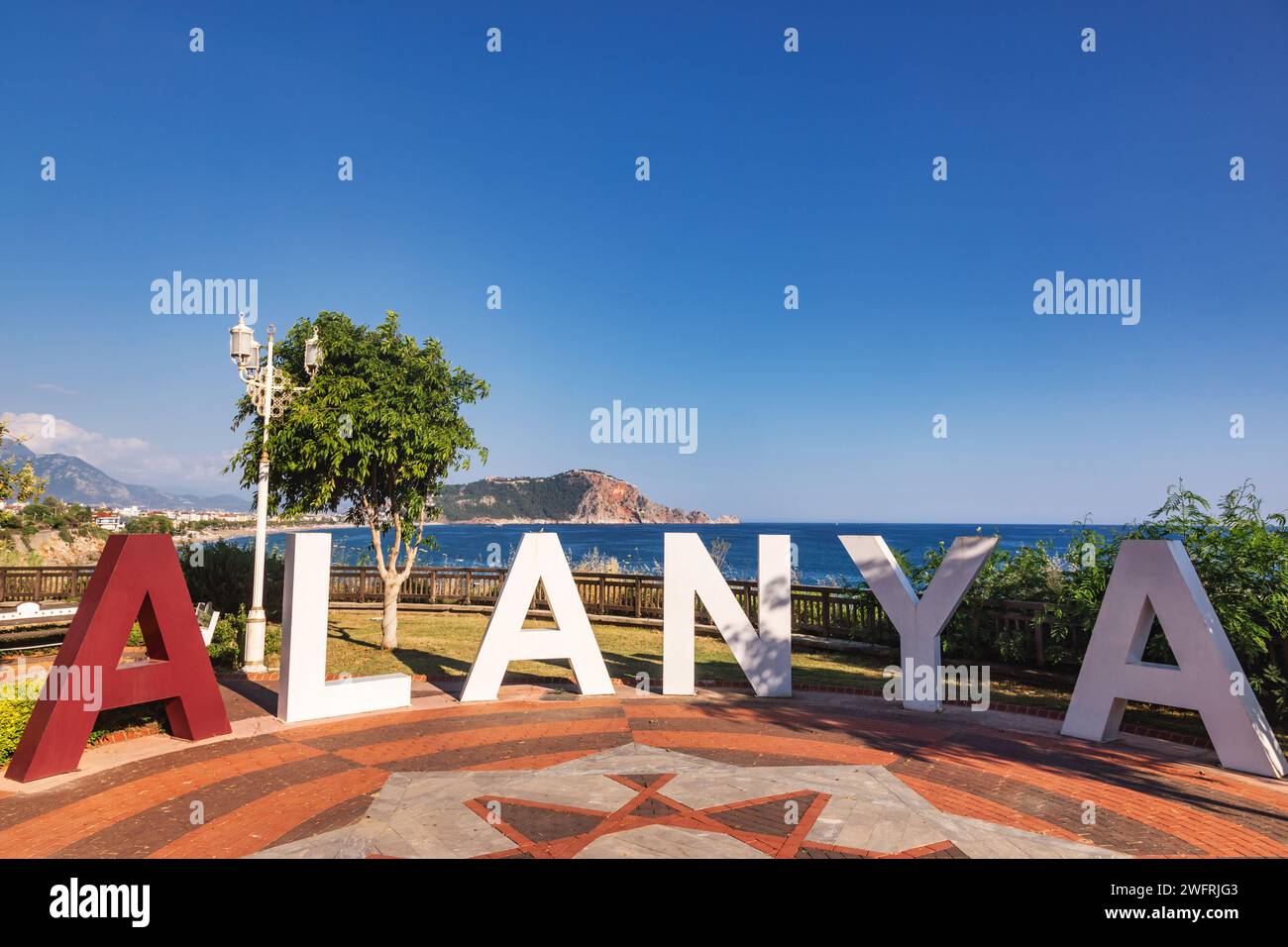 ALANYA sign with a scenic view of the sea and Alanya Castle in the ...