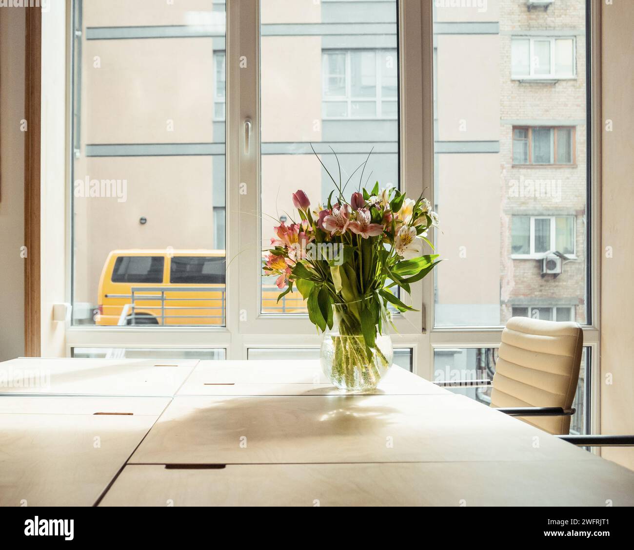 Empty room with table near the window and few chairs near that ...