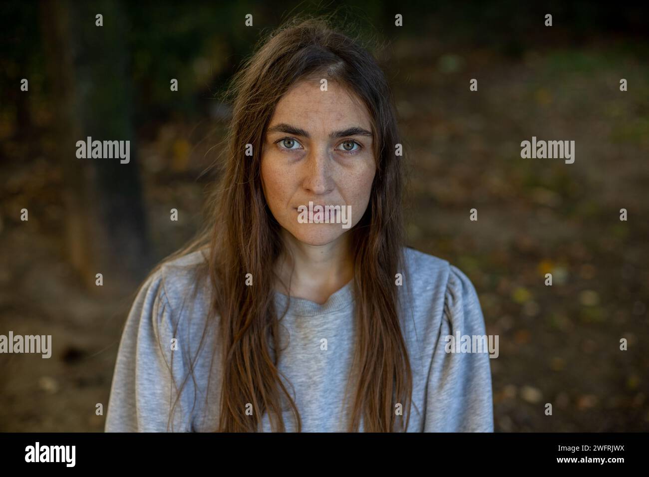serious woman looking at the camera Stock Photo - Alamy