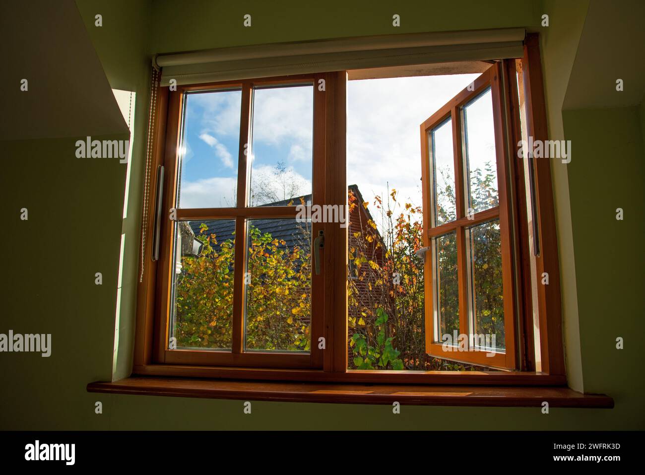 Double glazed wooden window frame in the home in the autumn season ...